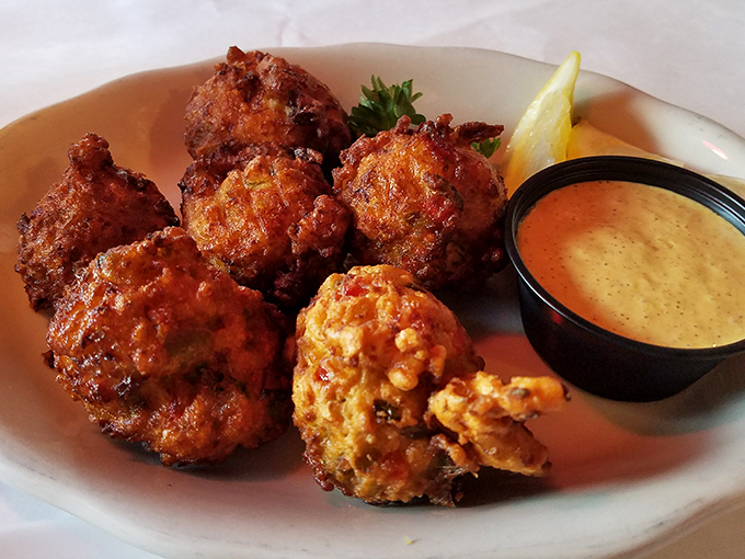 Conch fritters golden-fried to perfection with a side of tangy dipping sauce. These crunchy treasures are the Keys' answer to popcorn chicken. 