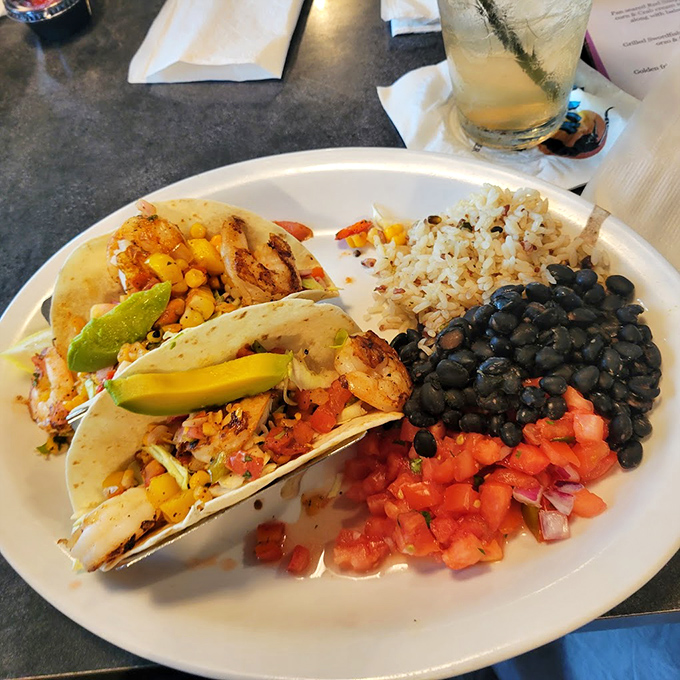 Taco Tuesday just got an upgrade! These shrimp tacos with fresh pico, black beans, and rice make you wonder why you'd ever eat anything else.