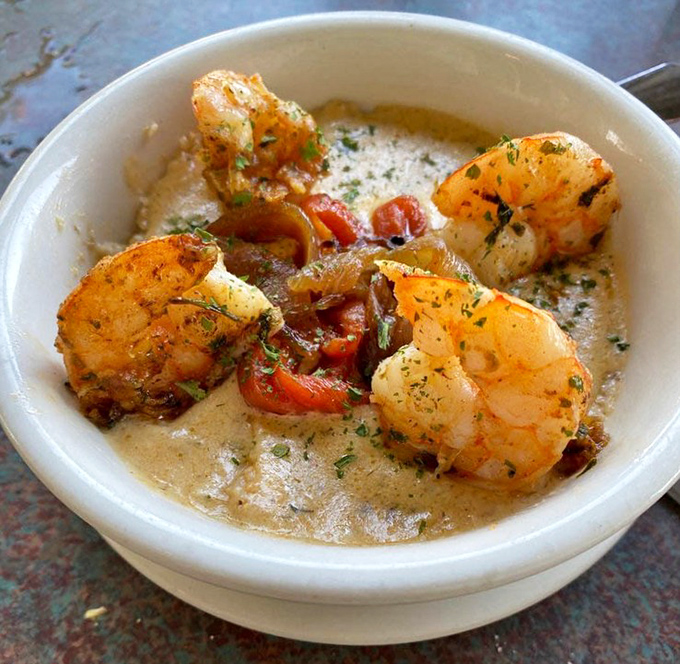 These shrimp aren't just resting on their grits&mdash;they're showing off in a savory sauce that would make your grandmother weep with joy.