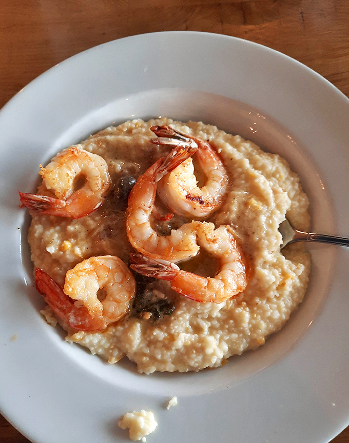 Shrimp and grits: where plump crustaceans lounge on a bed of creamy cornmeal like they own the place.