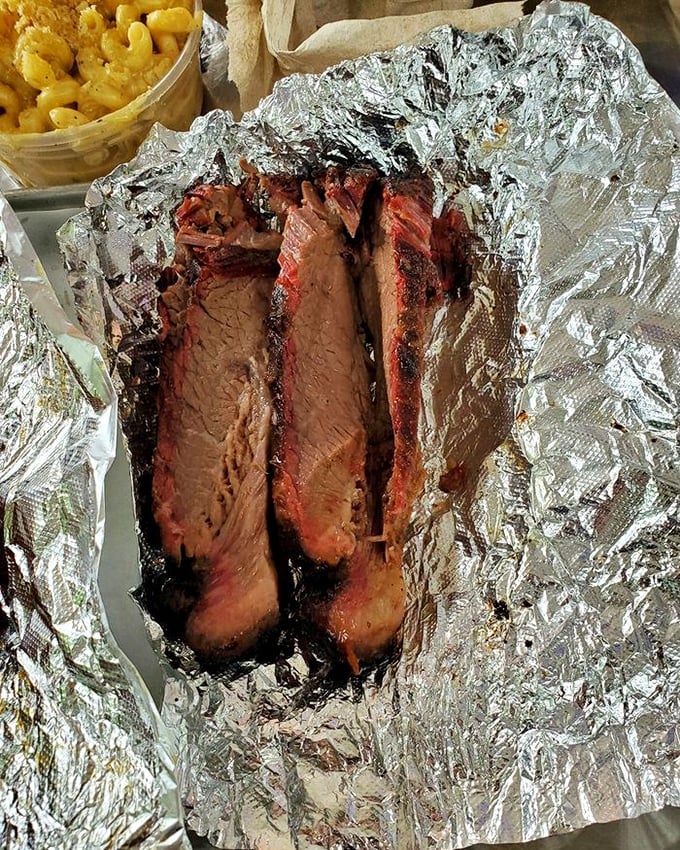 Brisket sliced this perfectly deserves a moment of silence. The smoke ring is practically a halo, sanctifying this beef to barbecue heaven.