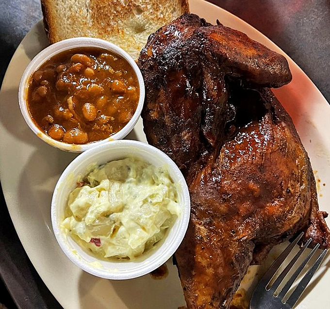 The smoked chicken arrives with sides of potato salad and baked beans&mdash;a trio that's been making Southerners smile since time immemorial.