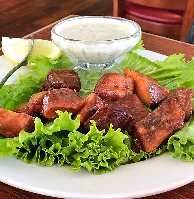 Smoked salmon bites nestled on crisp lettuce&mdash;proof that sometimes the simplest preparations let truly fresh seafood shine brightest.