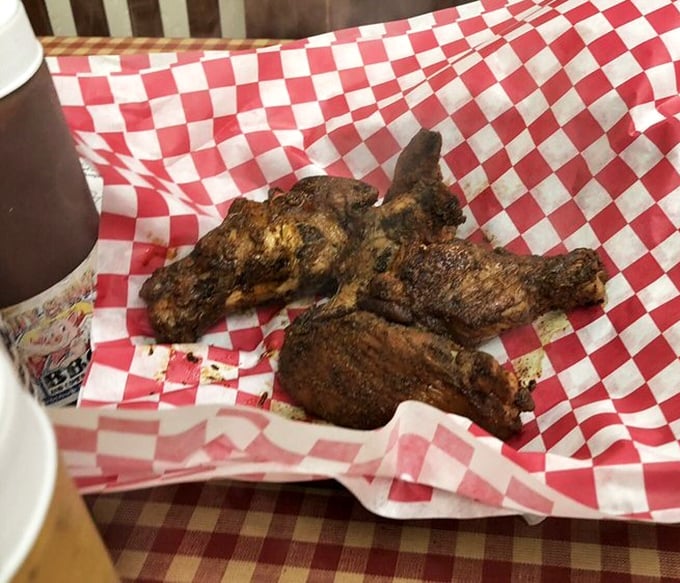 These wings have that mahogany bark that barbecue dreams are made of – crispy, spice-crusted skin protecting juicy meat beneath.