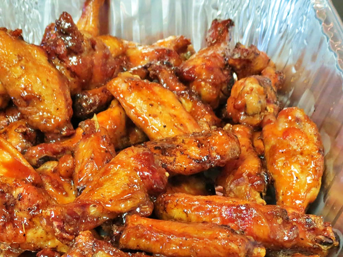 Wings so perfectly lacquered with sauce, they glisten like edible jewels. Napkins required, regrets impossible.