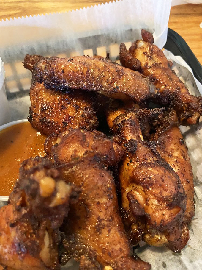 The legendary smoked wings &ndash; burnished to mahogany perfection, these aren't just wings; they're the reason cameras were invented for food.