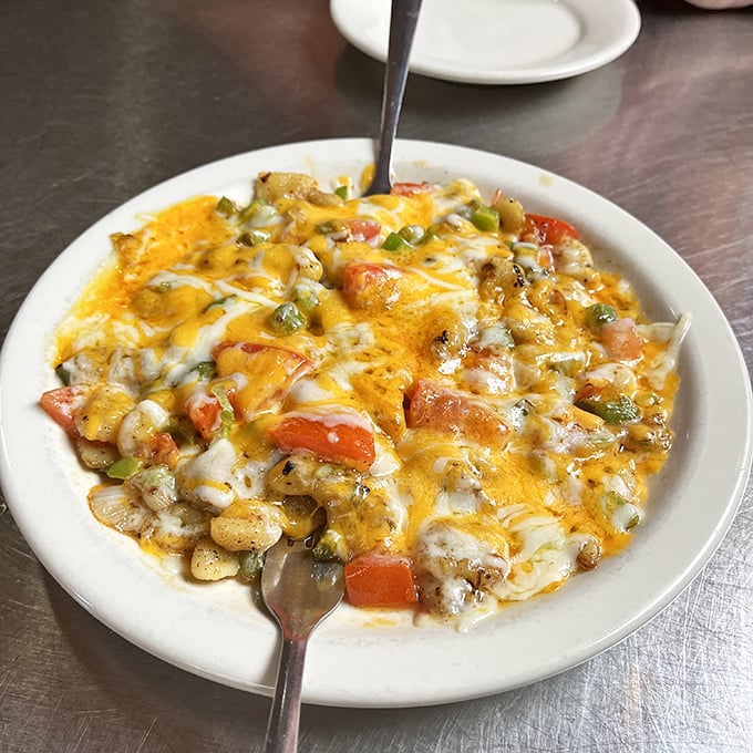 Melted cheese blankets this hearty skillet dish, creating a comfort food masterpiece that would make even a cardiologist momentarily weak-kneed.