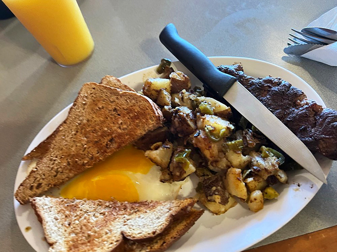 Steak and eggs done right – no fancy garnishes needed when the fundamentals are this perfectly executed.