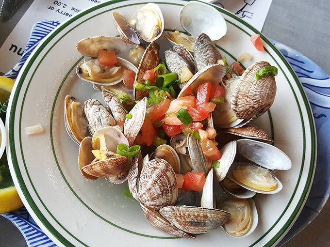These steamer clams aren't just seafood; they're an interactive experience where each shell opens to reveal a buttery, garlicky treasure.