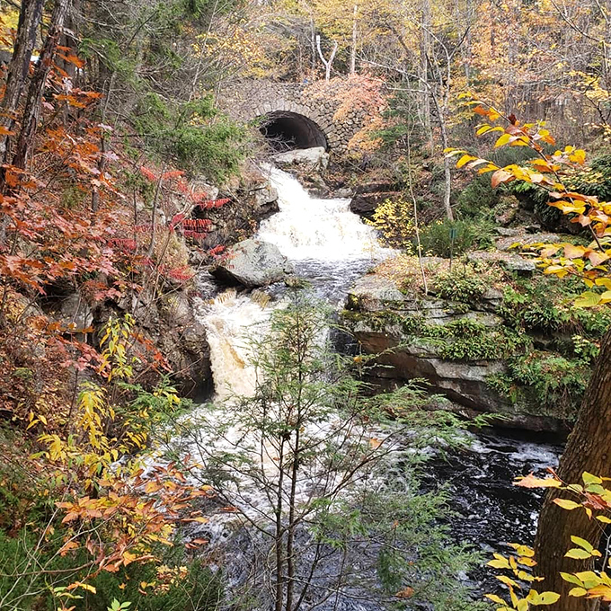 Hidden beneath this historic stone arch, the waterfall reveals itself like the surprise ending to nature's best novel.