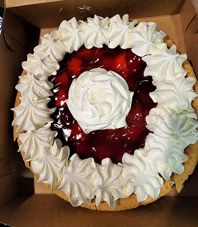 A strawberry pie that would make Agent Cooper weep with joy. That meringue crown deserves its own zip code and possibly a small government.
