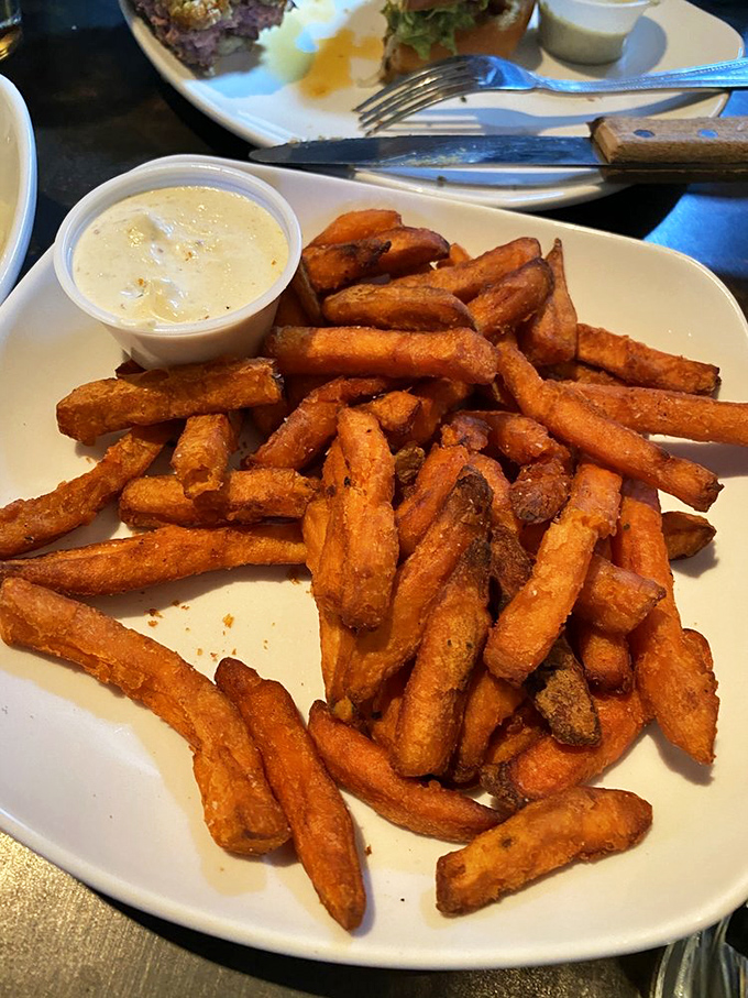 Sweet potato fries that strike the perfect balance between crispy and tender, with a dipping sauce that makes regular fries jealous.