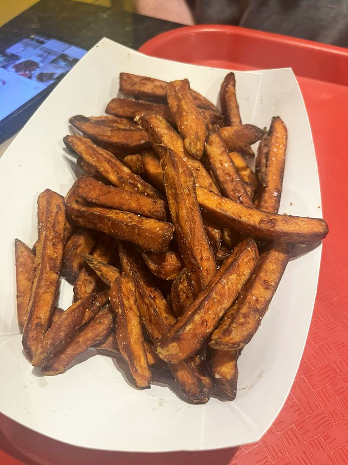 Sweet potato fries that redefine the side dish game. These aren't just orange alternatives to regular fries—they're what regular fries dream of becoming.
