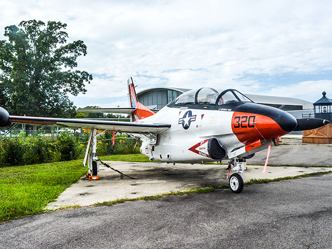 The workhorse UH-1 helicopter sits in quiet retirement, having traded its days of dramatic rescues for a life educating wide-eyed visitors about aviation history.