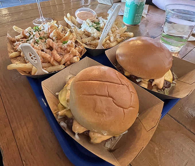 Burgers and loaded fries that demand to be photographed before being devoured. The perfect comfort food elevated to destination-worthy status.
