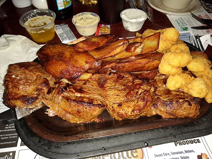 This sizzling tenderloin platter isn't just dinner&mdash;it's a celebration with crispy potatoes and golden cheese curds standing guard.