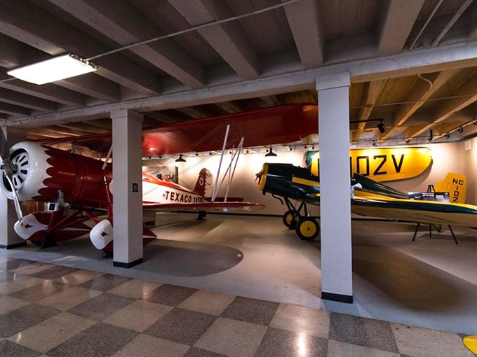 Vintage biplanes in their natural habitat&mdash;notice how the red Texaco plane seems to be showing off next to its yellow neighbor, like classic cars at a very specialized auto show.