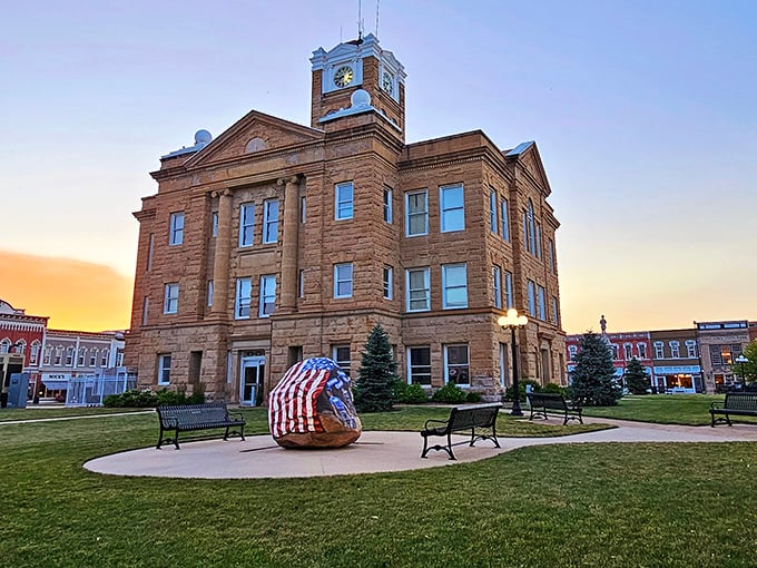 The Monroe County Courthouse at sunset transforms from government building to postcard-perfect centerpiece, proving small towns know how to dress up for evening.