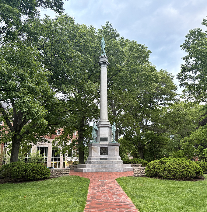Standing tall amid the greenery, this monument honors sacrifice while anchoring the community to its past&mdash;history written in stone and memory.