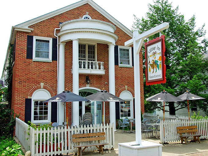 The Village Inn's classic brick facade and white columns aren't just charming &ndash; they're practically telegraphing "come in, the comfort food is waiting."