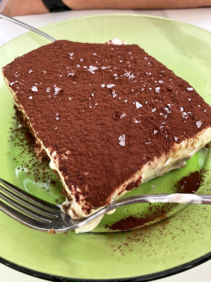 Tiramisu that makes you want to high-five the pastry chef – cocoa-dusted perfection with layers so light they practically float off the plate.