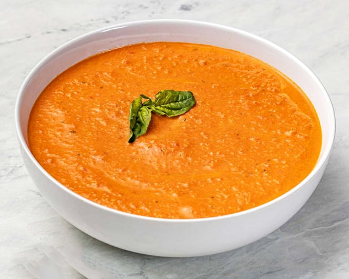 Vibrant tomato soup garnished with fresh basil&mdash;proof that even simple classics get the respect they deserve at this beloved buffet institution.
