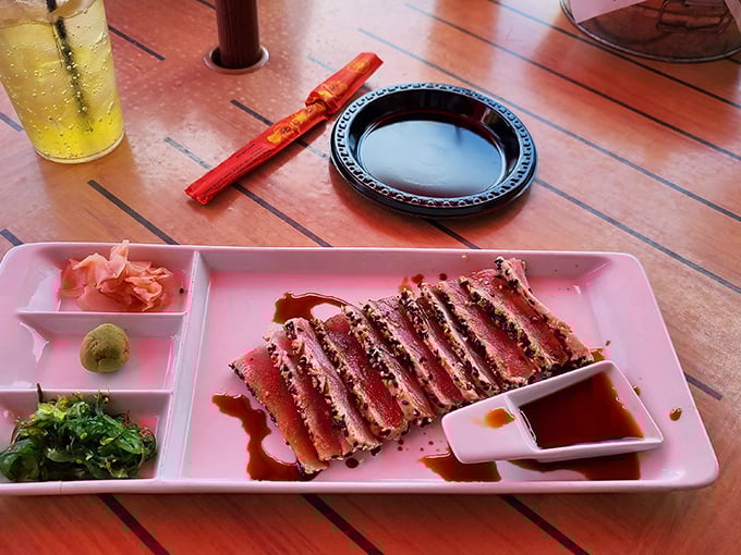 Seared tuna sliced with surgical precision, a splash of color and sophistication amid the lakeside comfort food.