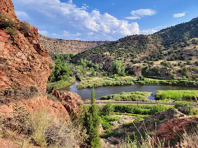 Red rock formations frame the Arkansas River like nature's own masterpiece. Somewhere, a landscape painter is feeling completely inadequate.