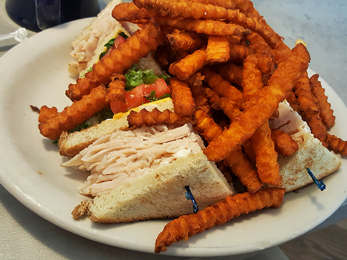 The turkey club: three layers of architectural sandwich perfection that makes you wonder why anyone would ever eat a single-decker again.