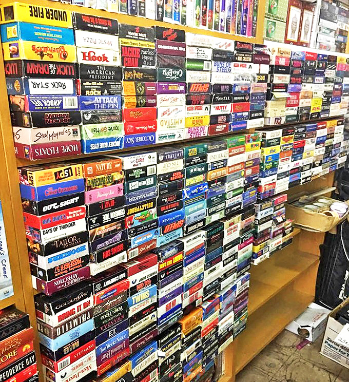 VHS tapes stacked like a time capsule of entertainment history&mdash;nostalgia sold by the plastic case.