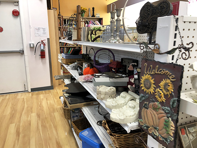 Seasonal decorations mingle with everyday home goods in this aisle, where someone's discarded "Welcome" sign becomes your porch's new personality piece.