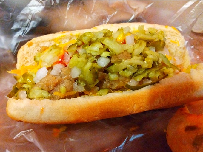 The Ultradog doesn't believe in minimalism. Like a good Michigan potluck, it brings everything to the party &ndash; kraut, onions, pickles, and cheese living their best life together.