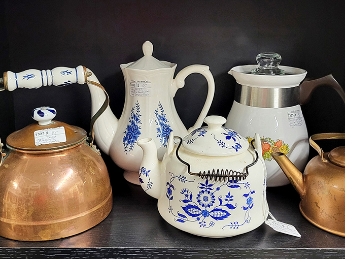 Teapots and kettles that brewed morning conversations for generations. That copper kettle probably witnessed more family secrets than a therapist.