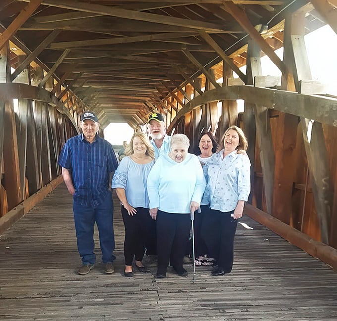 Inside the bridge, generations gather to share stories. These wooden beams have witnessed countless family reunions and first kisses.