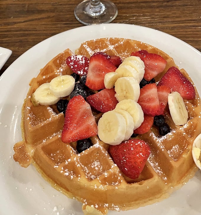 A waffle that's dressed for success with fresh berries and bananas. The powdered sugar dusting isn't garnish&mdash;it's the fairy dust that makes breakfast magical.