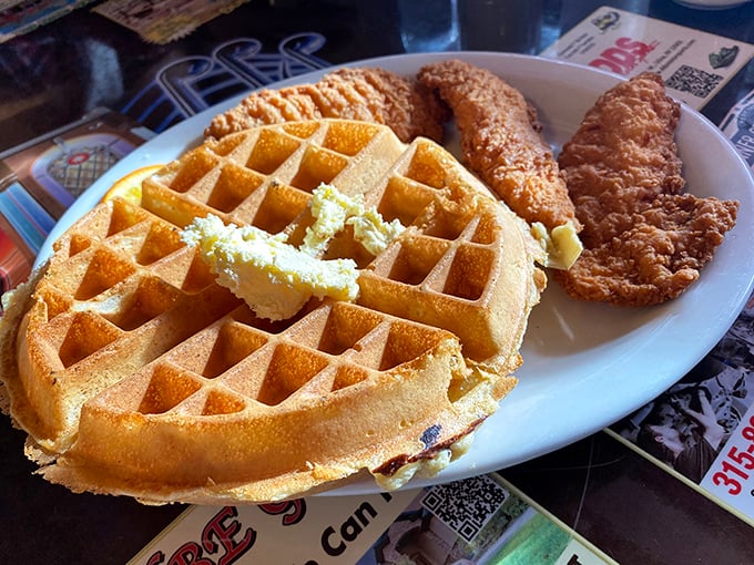 This golden waffle with crispy chicken isn't just breakfast&mdash;it's an edible American flag that tastes like freedom and butter.