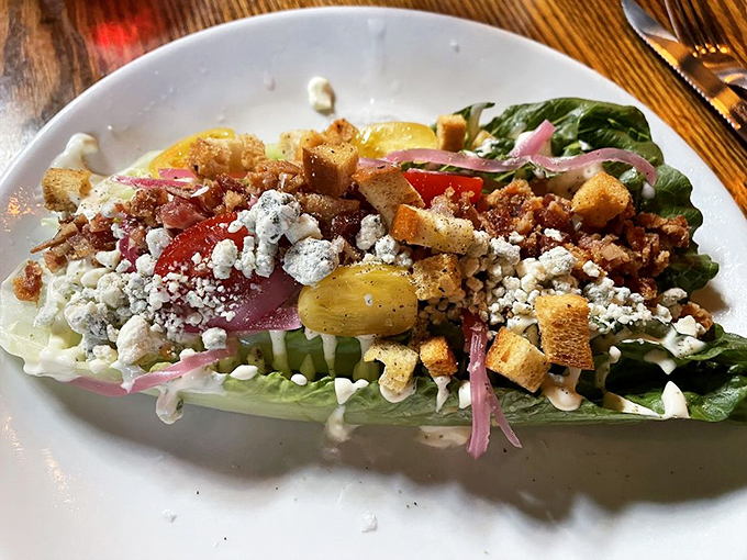The wedge salad that makes vegetables feel like they're attending a black-tie affair. Blue cheese and bacon playing the roles of cufflinks and tiara.