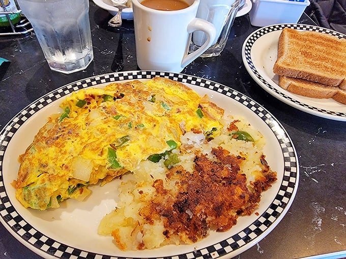 That Western omelet is stuffed so generously, it's basically a vegetable garden wrapped in golden eggs.