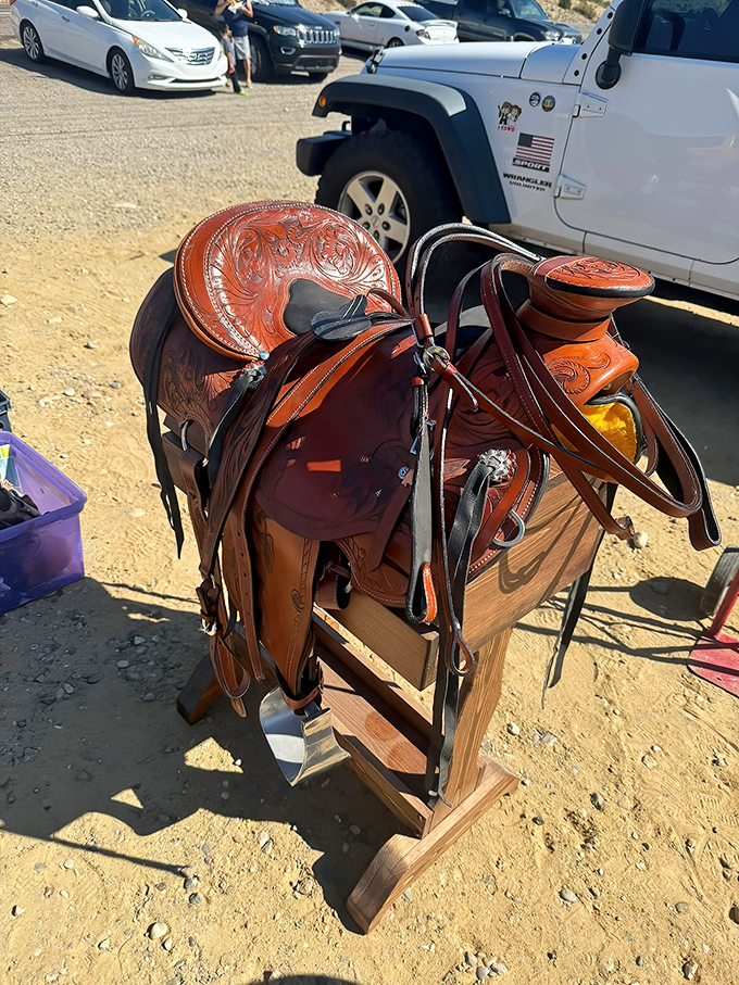 A hand-tooled Western saddle gleams in the sun, its leather telling stories of desert rides and cattle drives yet to come.
