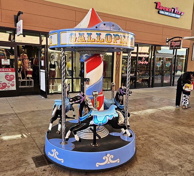 This charming mini-carousel offers a moment of nostalgic delight for young shoppers, proving retail therapy isn't just for grown-ups at the Outlets.