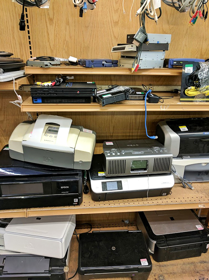 The electronics graveyard - where yesterday's cutting-edge technology awaits brave souls willing to gamble on second chances.