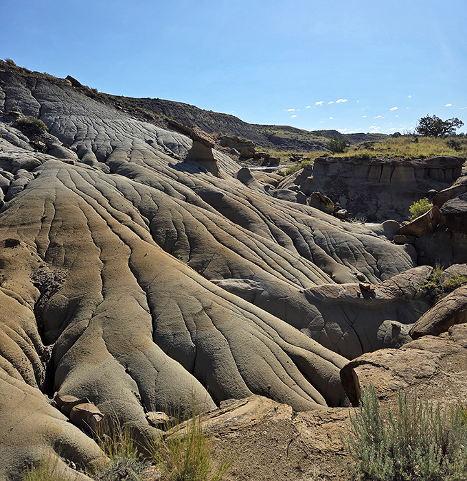 Nature's wrinkles reveal the passage of time. These undulating formations look like they've been sculpted by a giant's hand playing with clay.