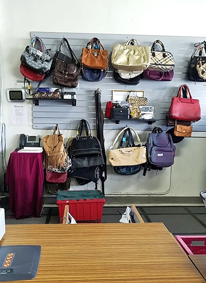 Handbag heaven! Designer purses and everyday totes displayed like an art gallery of functional fashion, proving one shopper's castoff is another's signature accessory.