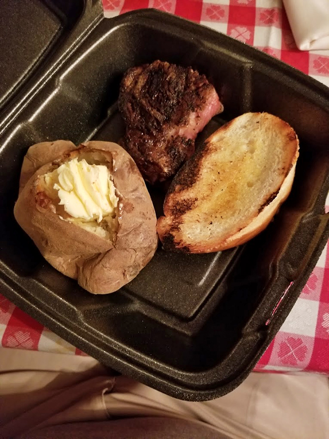 Potato perfection waiting to be devoured. Split open to reveal its fluffy interior, it's the ideal canvas for butter and salt.