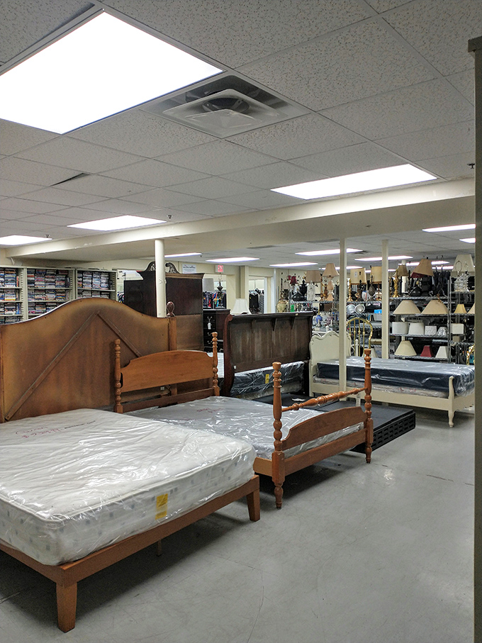 Bedroom furniture awaits new dreams, with headboards and mattresses lined up like hopeful contestants on a home makeover show.