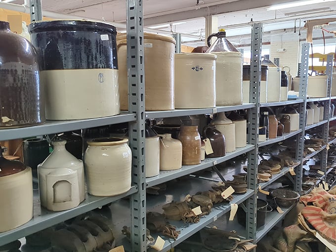 Ceramic crocks and stoneware jugs line the shelves like soldiers. Once utilitarian necessities, now they're coveted decorative pieces for farmhouse-chic enthusiasts.