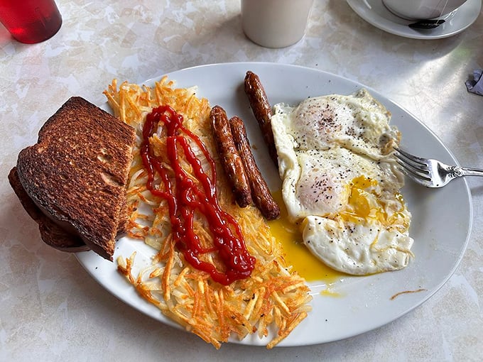 Breakfast doesn't get more honest than this&mdash;sunny-side eggs, crispy hash browns, and sausage links that would make any lumberjack weep with joy.