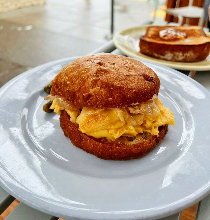 This breakfast sandwich isn't just a meal, it's a revelation&mdash;golden eggs and melted cheese embraced by a bun that deserves its own fan club.