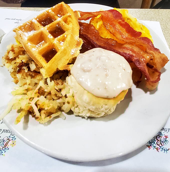 Waffles, bacon, and biscuits with gravy, oh my! A glorious morning platter that says "Wake up, buttercup, it’s going to be a great day."