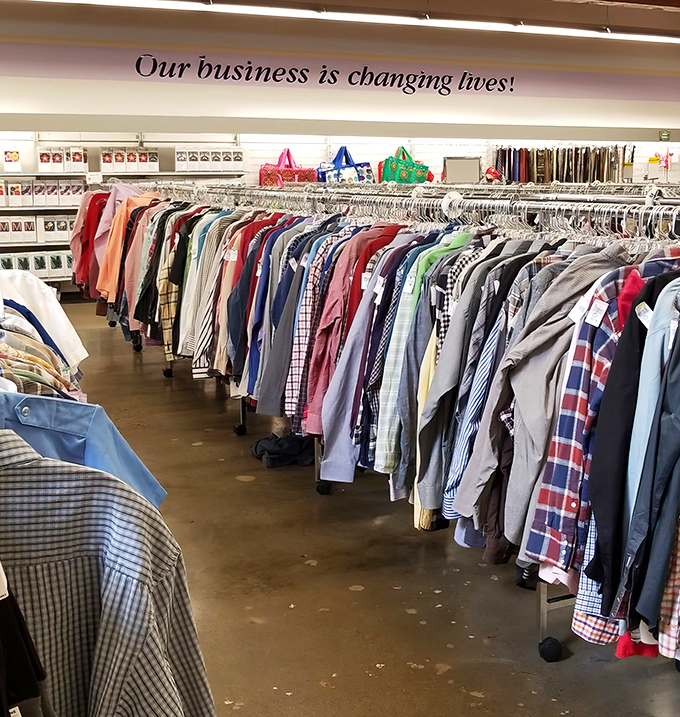 "Our business is changing lives!" proclaims the sign above an endless sea of button-downs, each with its own story to tell.